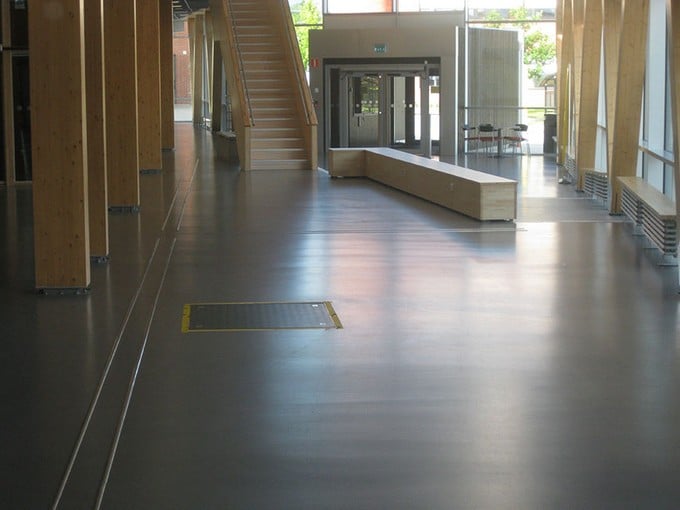 Underlayment and decorative floor in university building